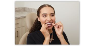 4Col_woman-inserting-aligner - Oral Health Group